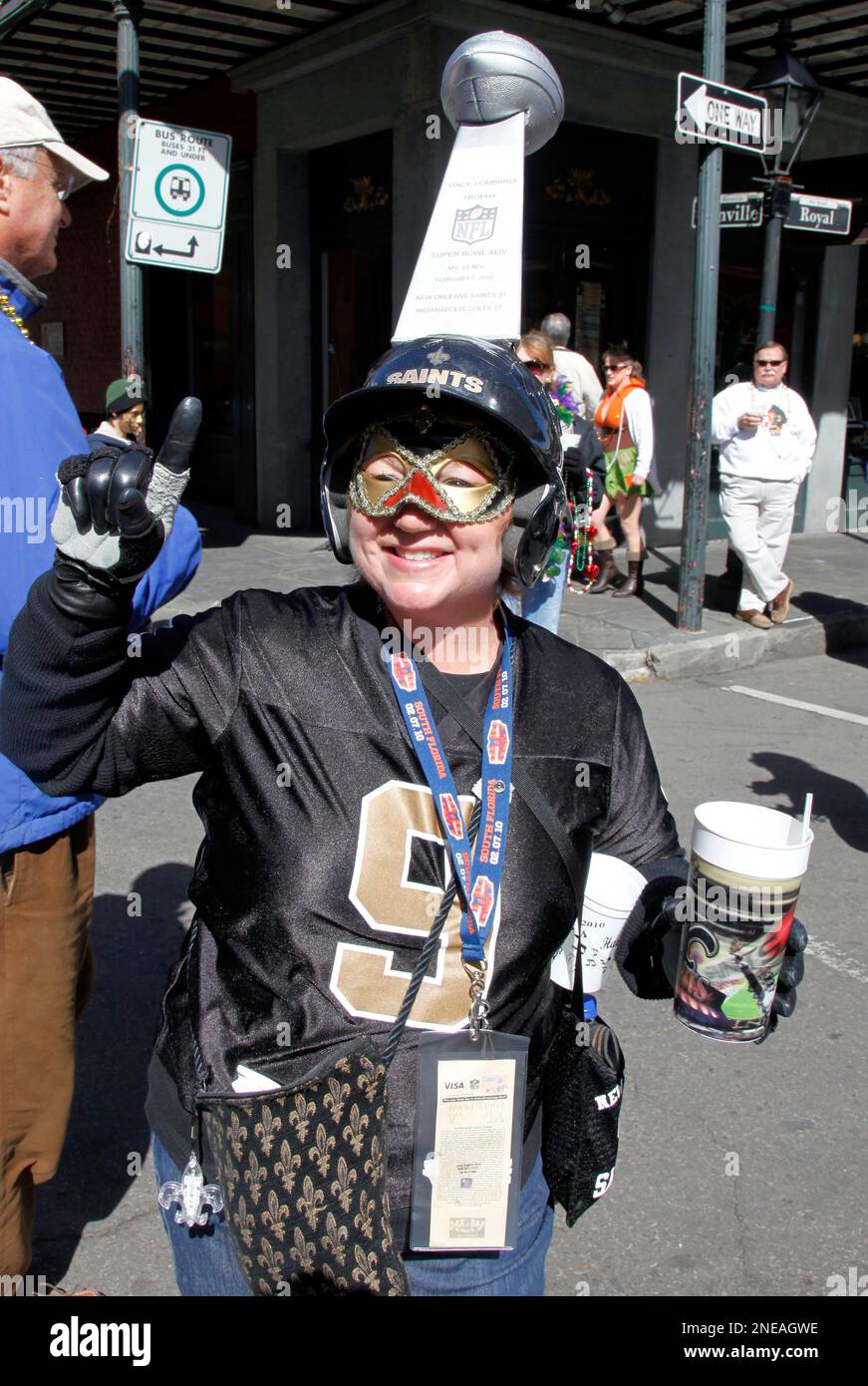 Nancy Trosclair wears the Lombardi Super Bowl trophy on her head as she ...