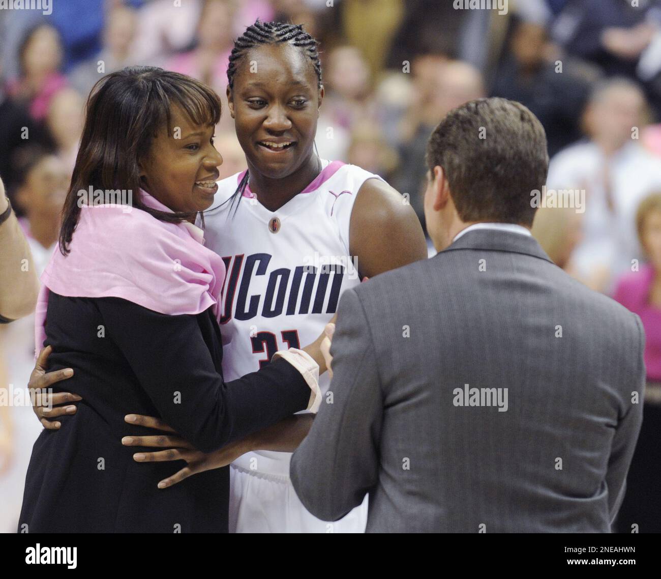 Connecticut's Tina Charles, right, hugs her mother, Angella Holgate ...
