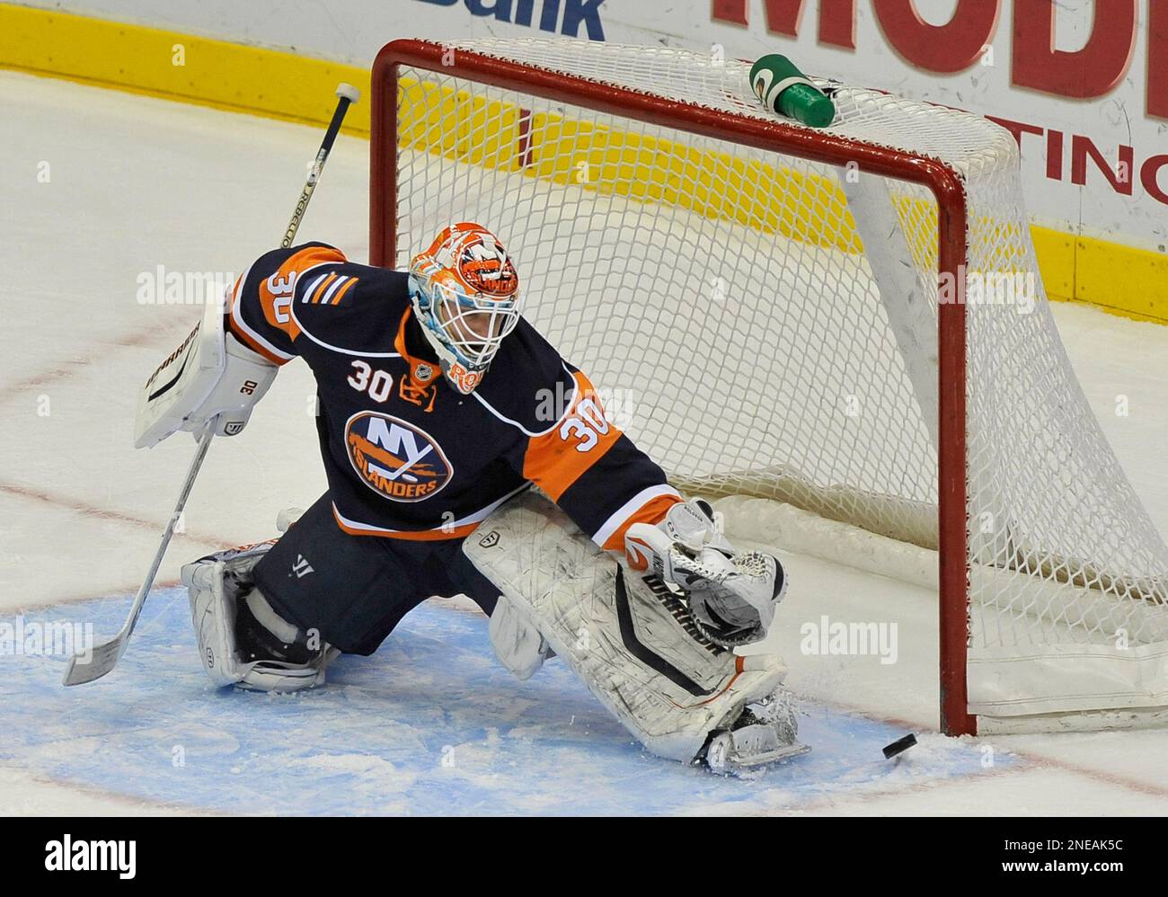 New York Islanders' goalie, Dwayne Roloson (30) makes a save against ...