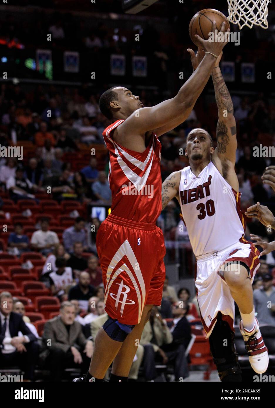 Houston Rockets center Chuck Hayes, left, shoots as Miami Heat forward ...