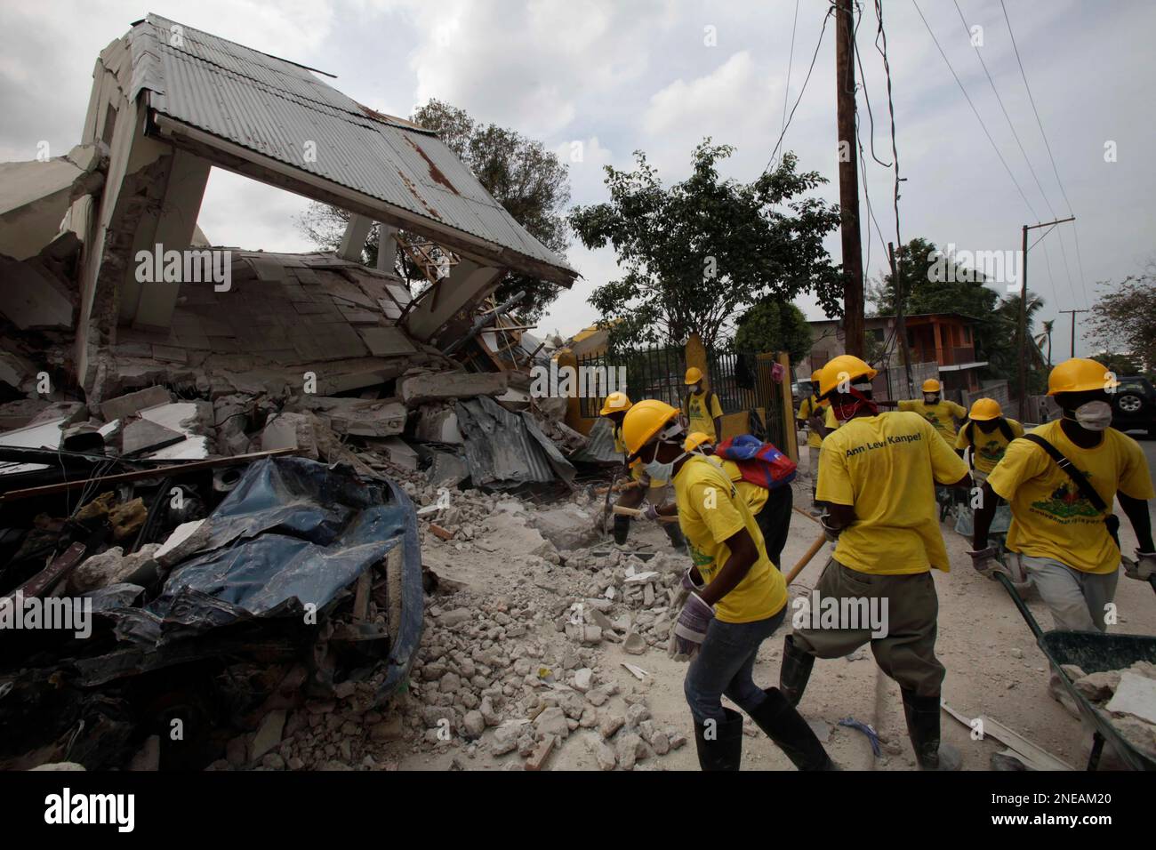 Government clean-up crews work on clearing the debris from an ...