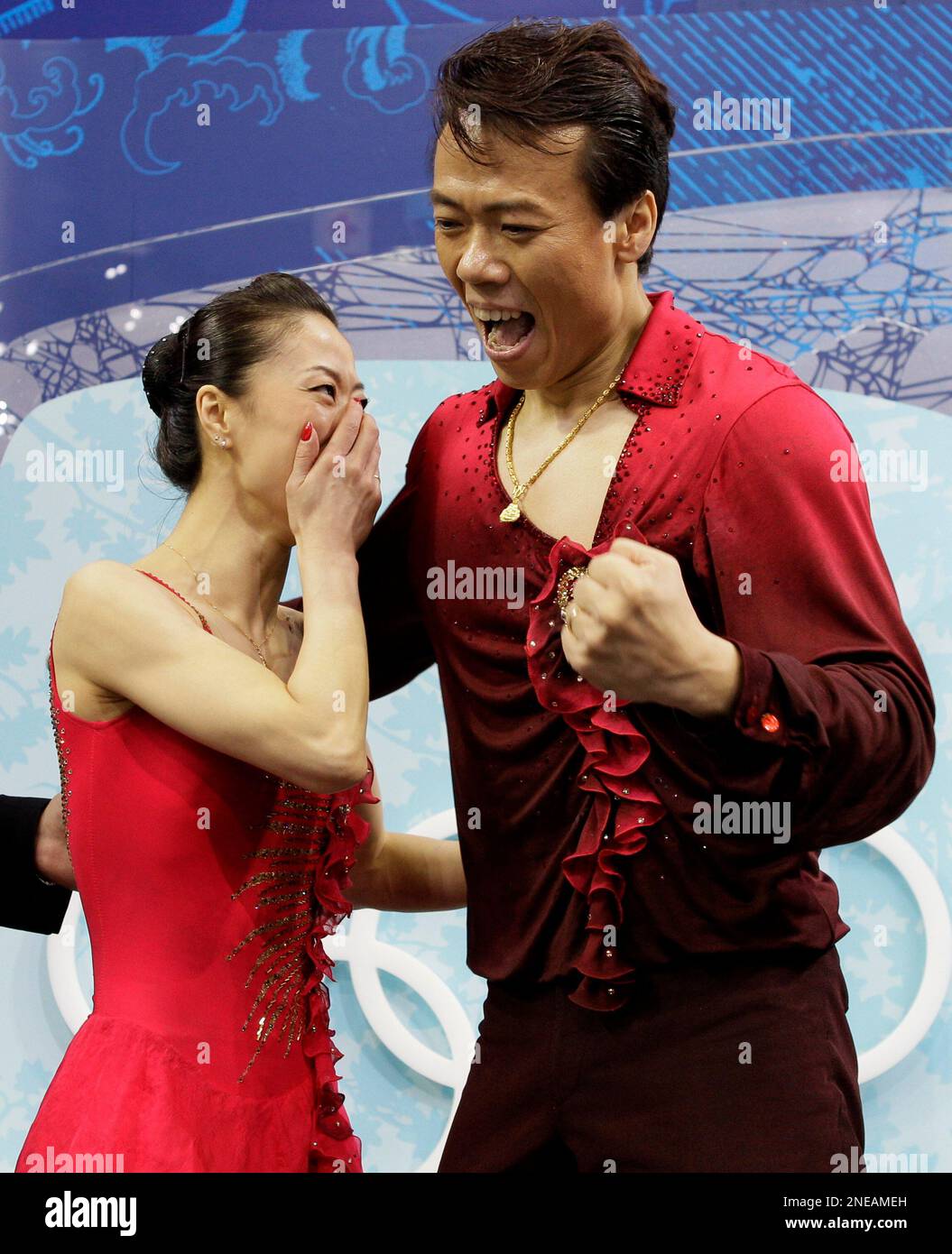China's Shen Xue and Zhao Hongbo react after receiving the highest ...