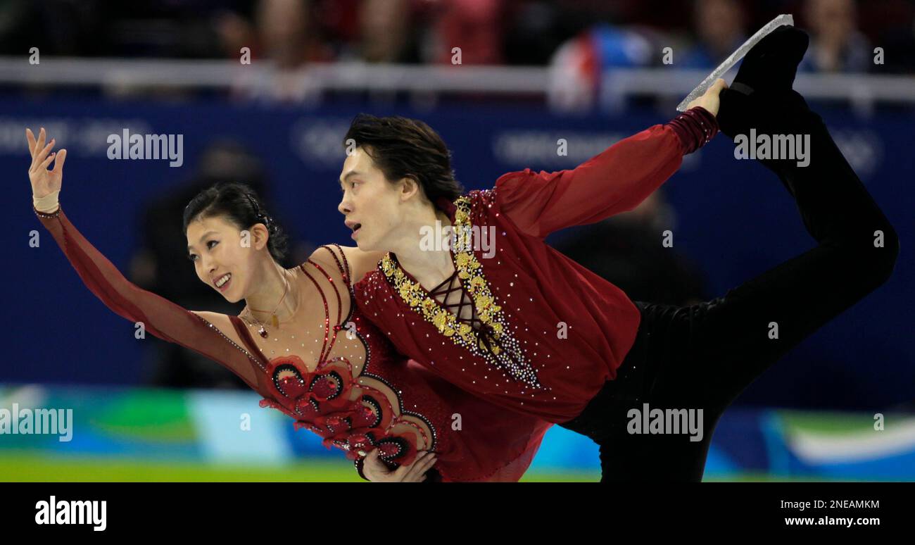 China's Pang Qing and Tong Jian perform their pairs free program during ...
