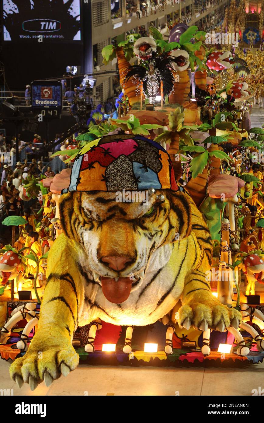 Dancers of Porto da Pedra samba school perform on a float during ...