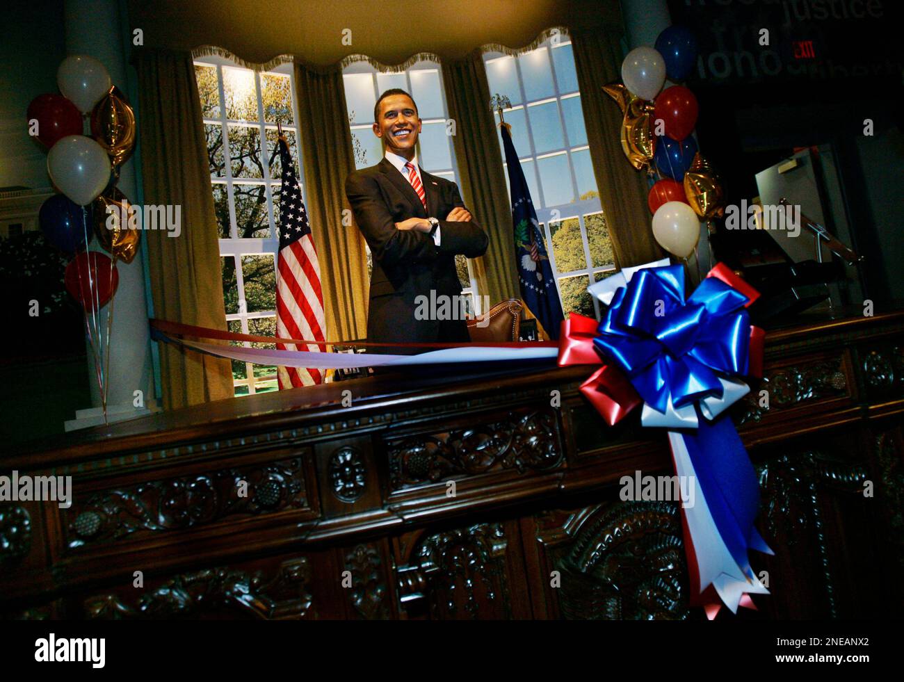 A $300,000 wax replica of Barack Obama sits moments before the official ...