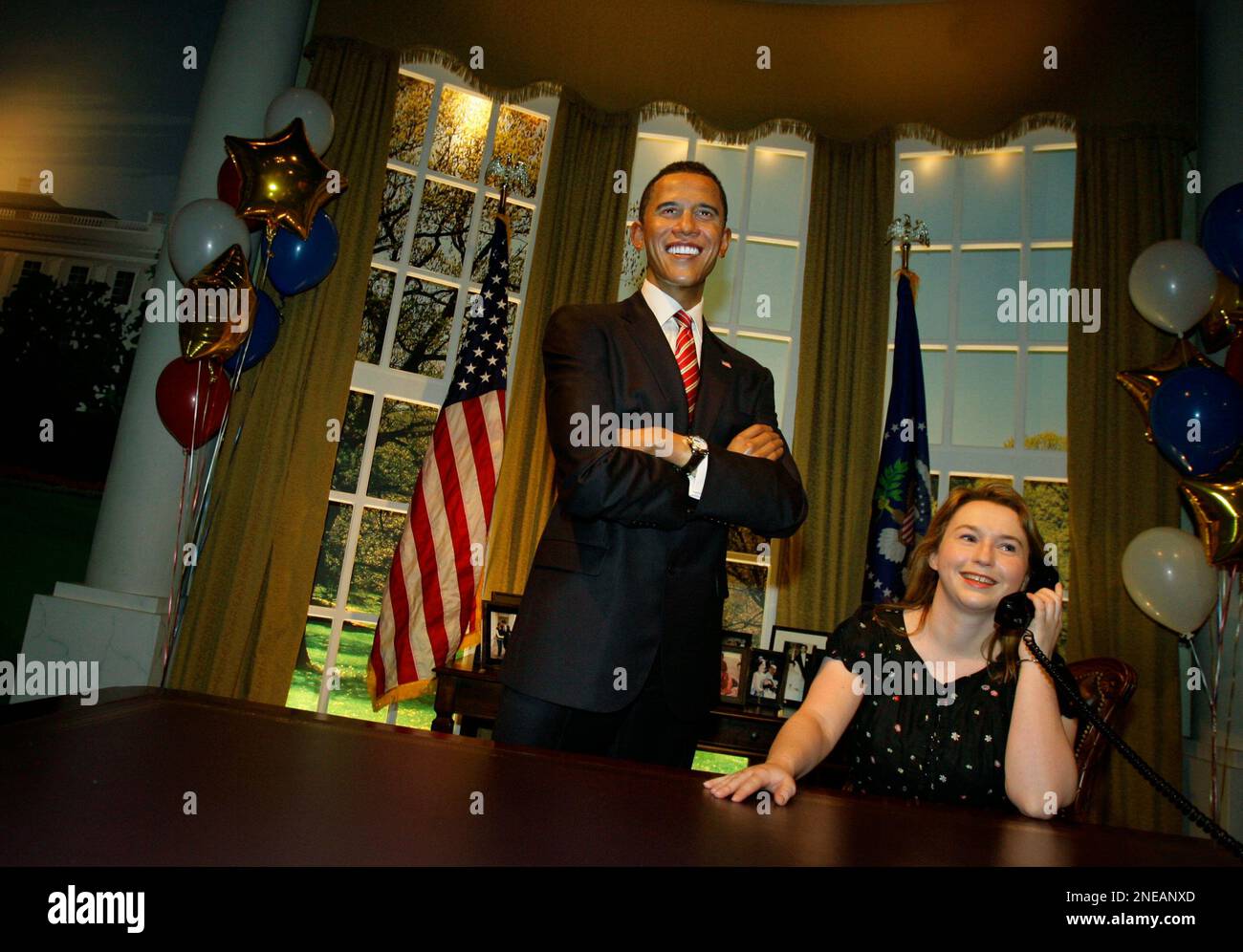 Laura O'Brien of London pretends to talk on the phone while visiting ...