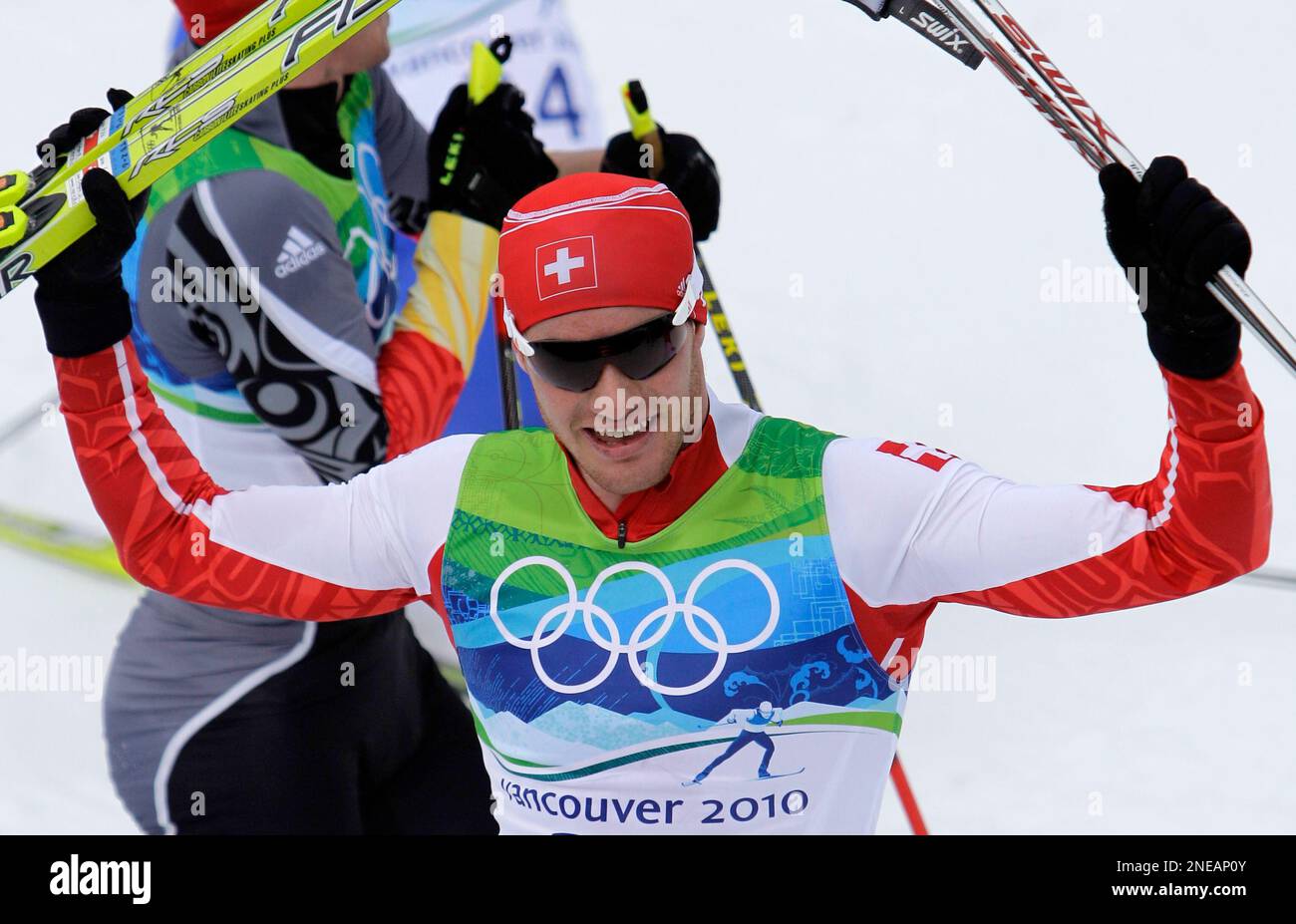 Switzerland's Dario Cologna celebrates winning the gold medal after the ...