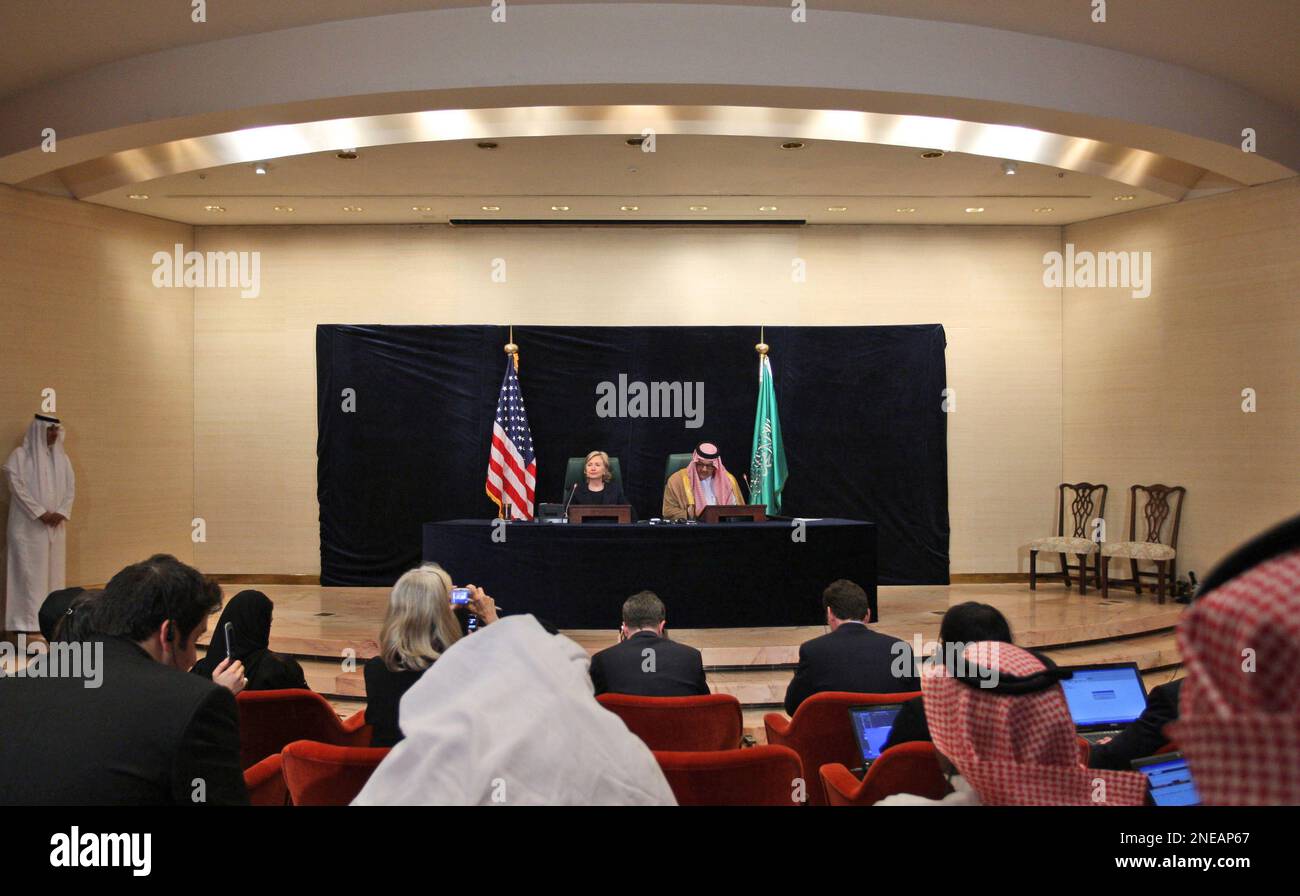 Saudi Arabian Foreign Minister Prince Saud al-Faisal, right, delivers a ...