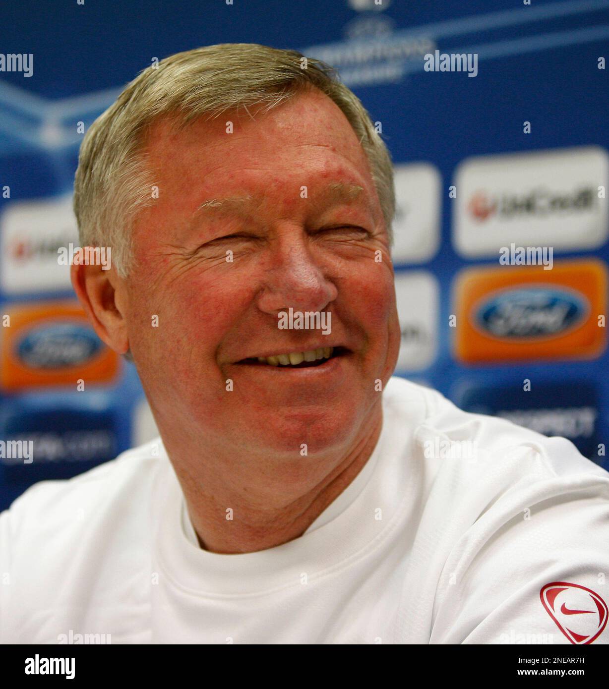 Manchester United coach Alex Ferguson smiles as he meets the media ...