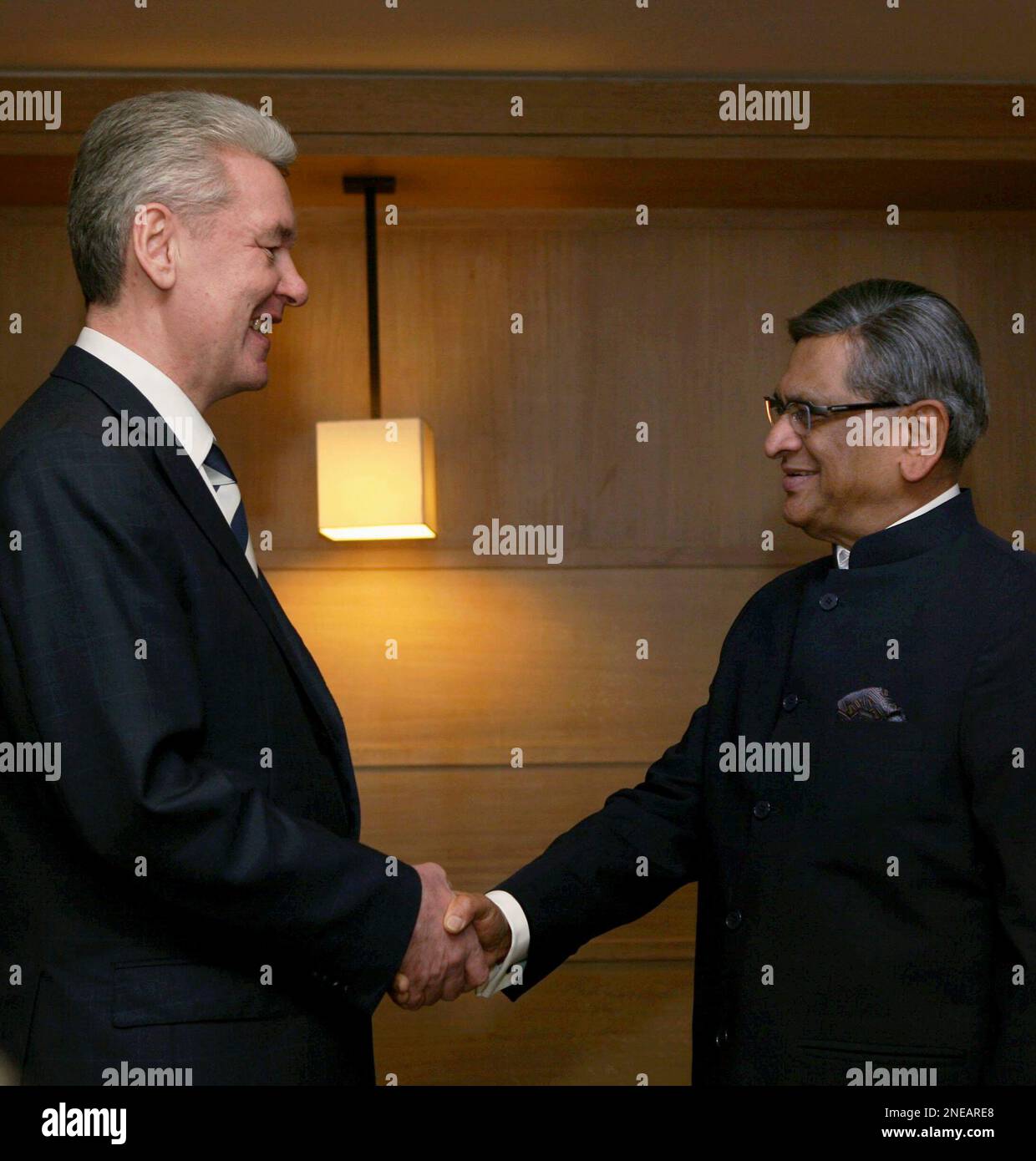 Russian Deputy Prime Minister Sergei Sobyanin, left shakes hands with ...