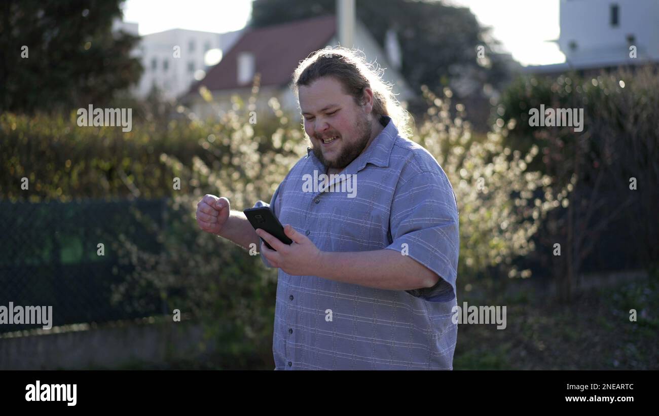 One enthusiastic man celebrating successful job application while ...