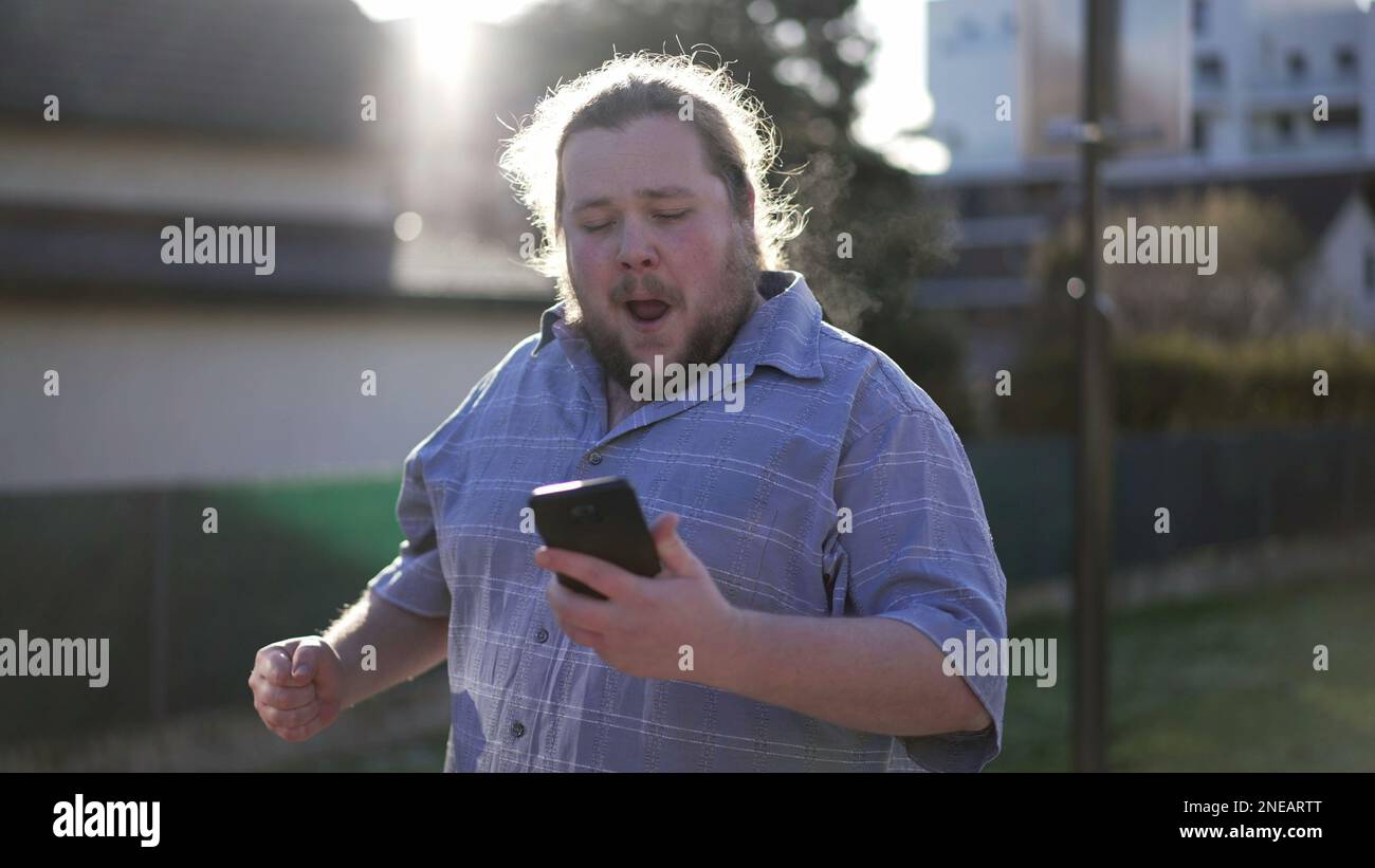 One enthusiastic man celebrating successful job application while ...