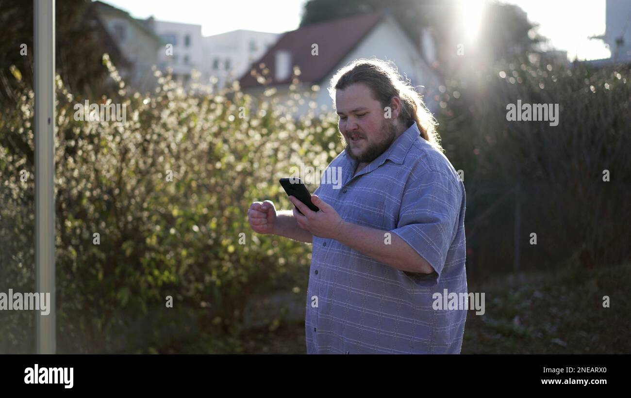 One enthusiastic man celebrating successful job application while ...