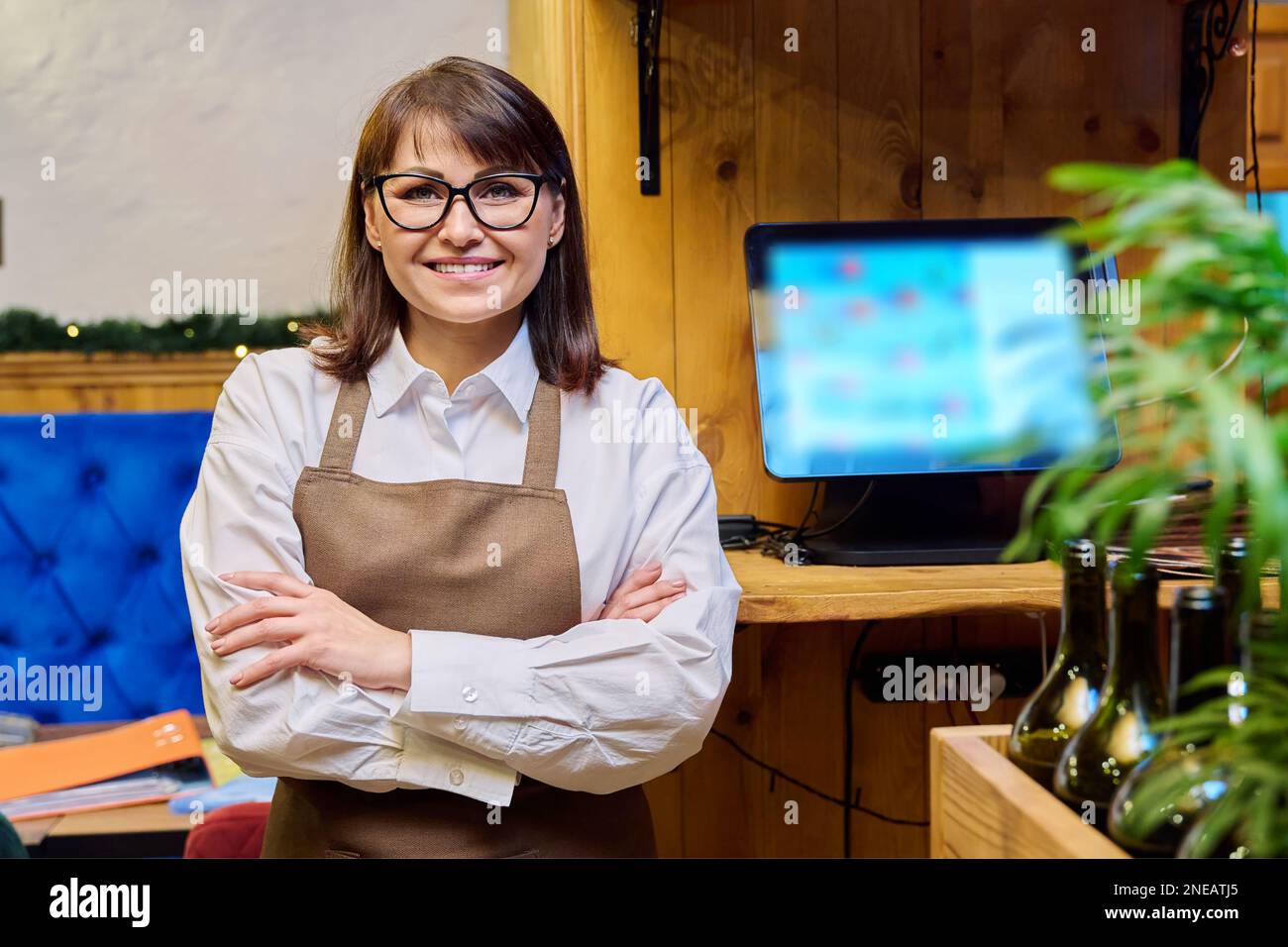 Portrait of middle aged confident woman restaurant owner Stock Photo ...