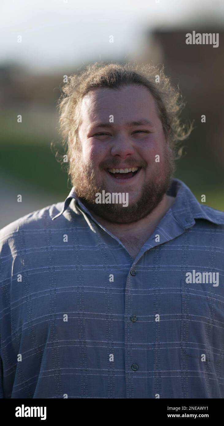 One overweight young happy man real life laugh and smile. Portrait of a ...