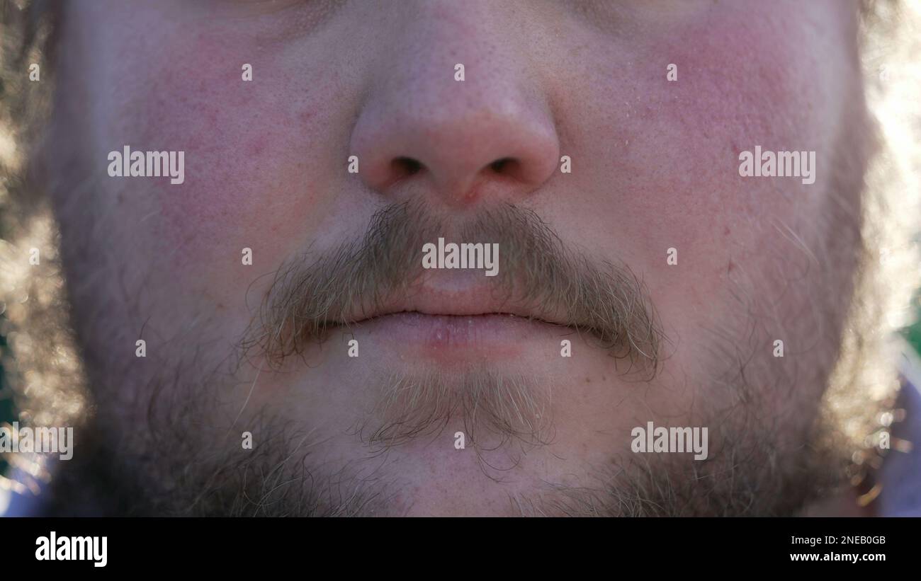 Grumpy Young man mouth close up becoming angry and upset. Change of ...