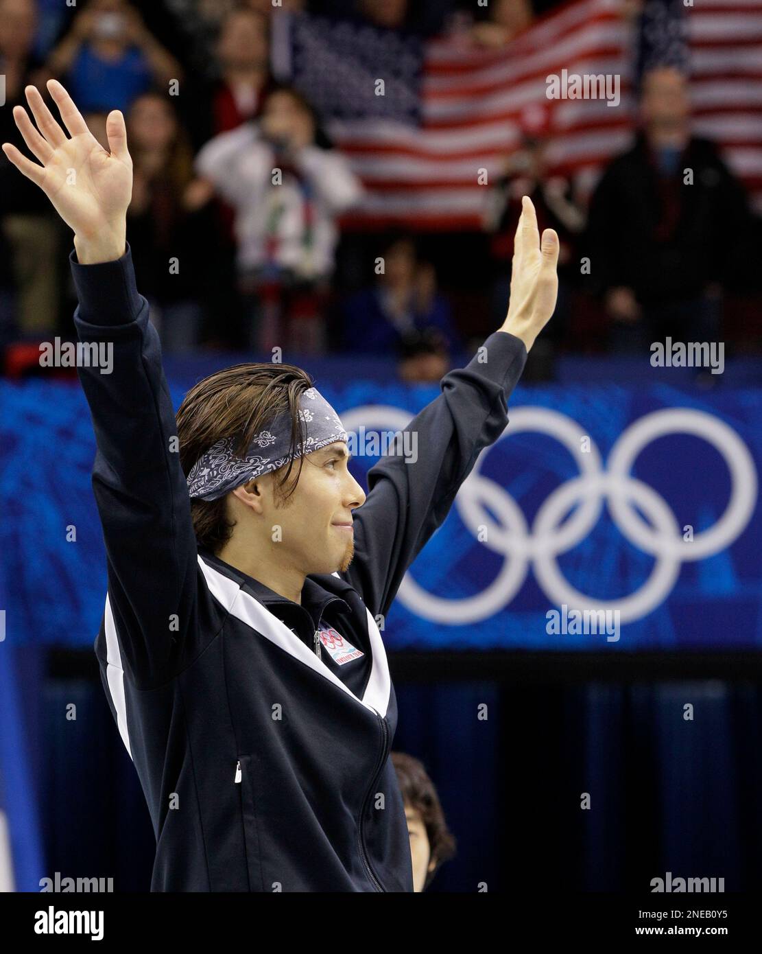 USA's Apolo Anton Ohno reacts on the podium during the flower ceremony, after winning silver in ...
