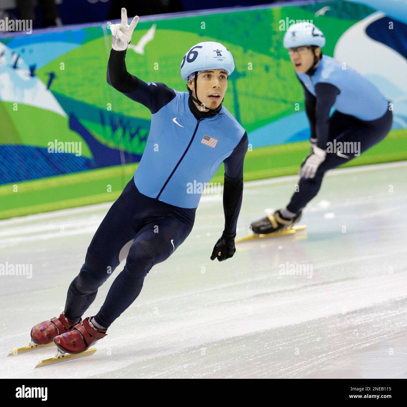 USA's Apolo Anton Ohno, left, gestures after placing second in the men's 1500m finals short ...