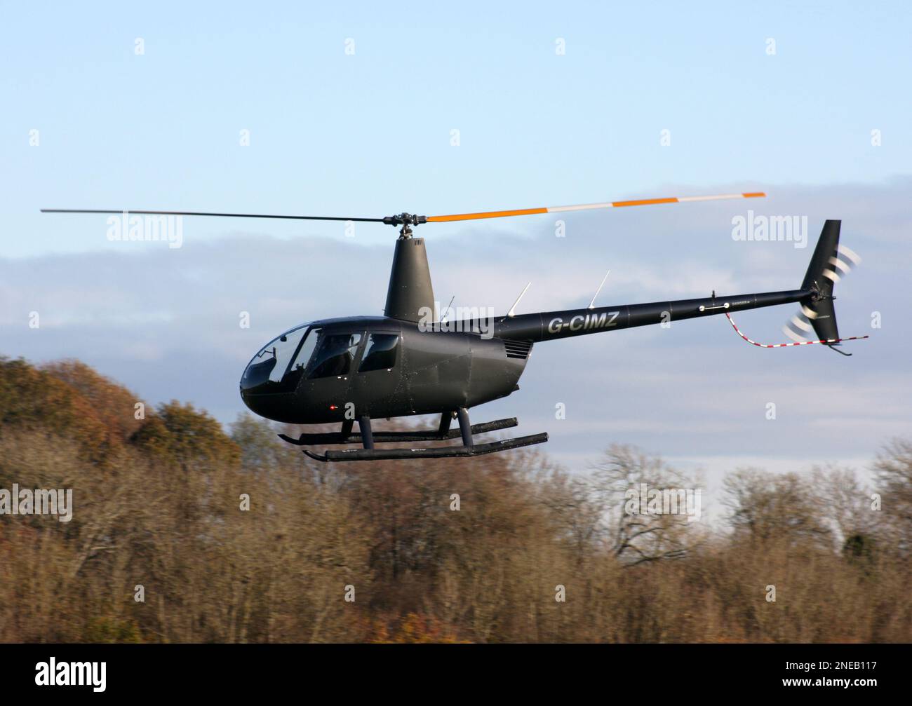 A Robinson R44 Raven II helicopter arriving at Redhill Aerodrome Surrey ...