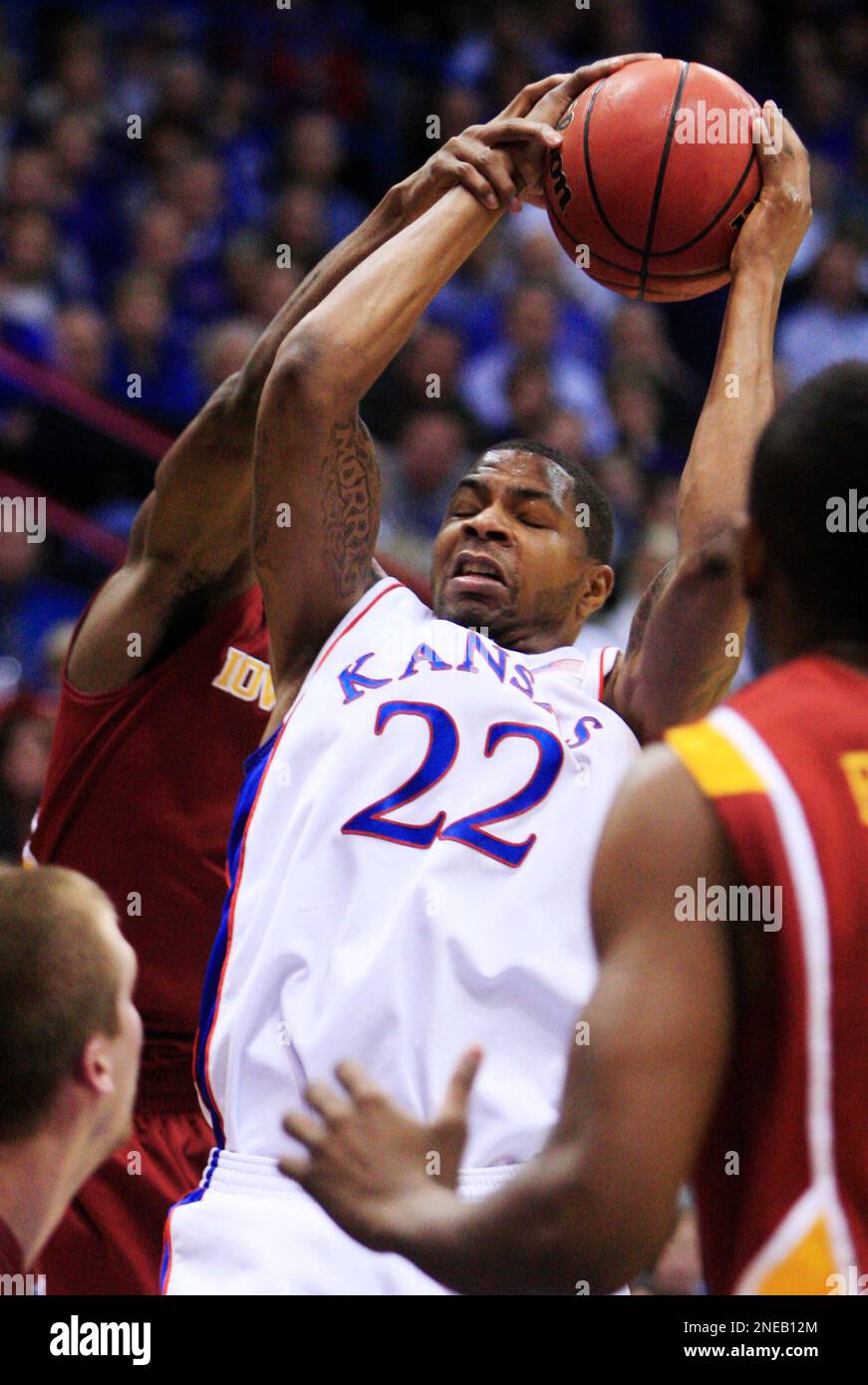 Kansas forward Marcus Morris (22) is fouled by Iowa State forward ...