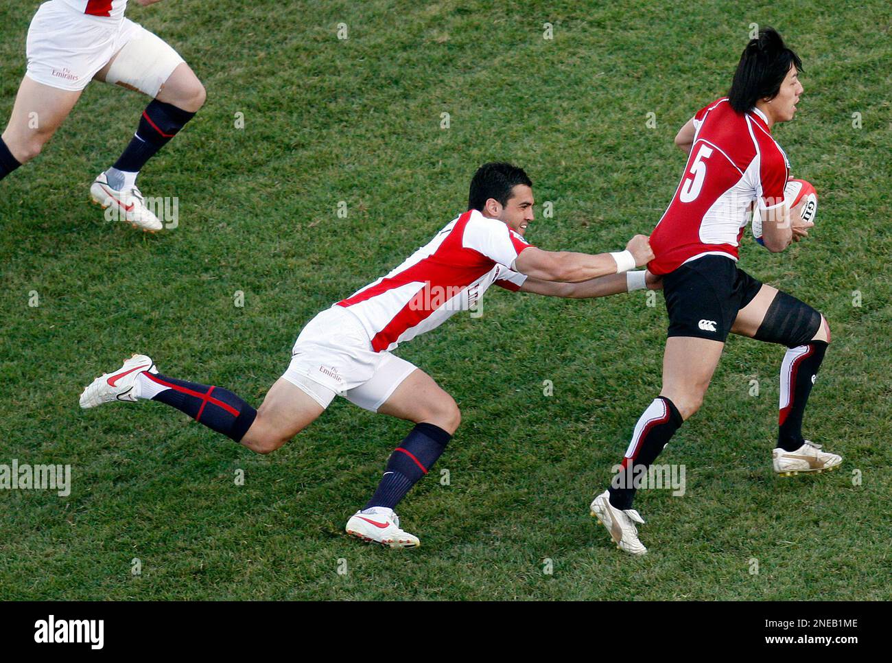 England's Jake Abbott attempts to pull down Japan's Kaoru Matsushita ...