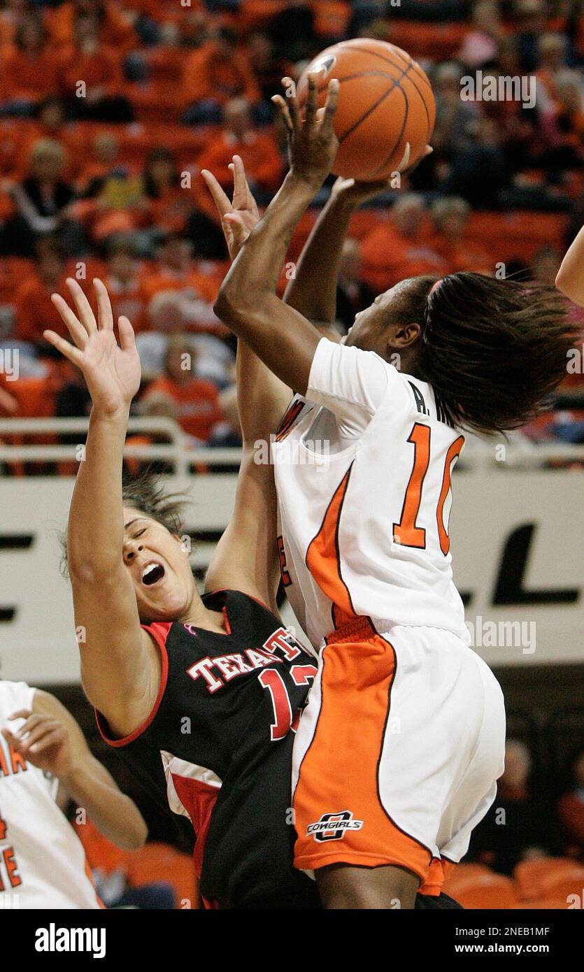 Oklahoma State guard Andrea Riley, right, collides with Texas Tech ...