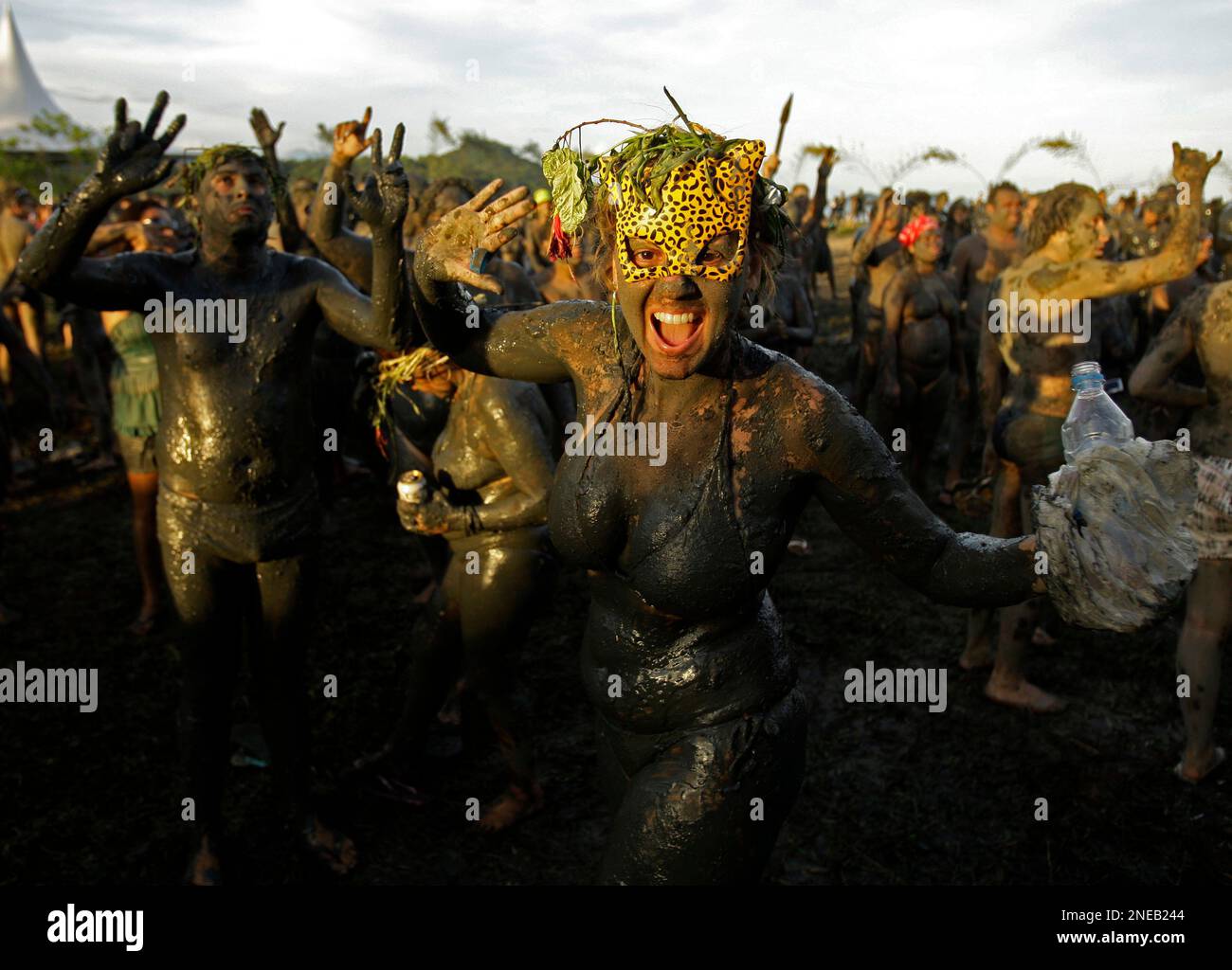 Revelers dance during the traditional "Bloco da lama" mud carnival ...
