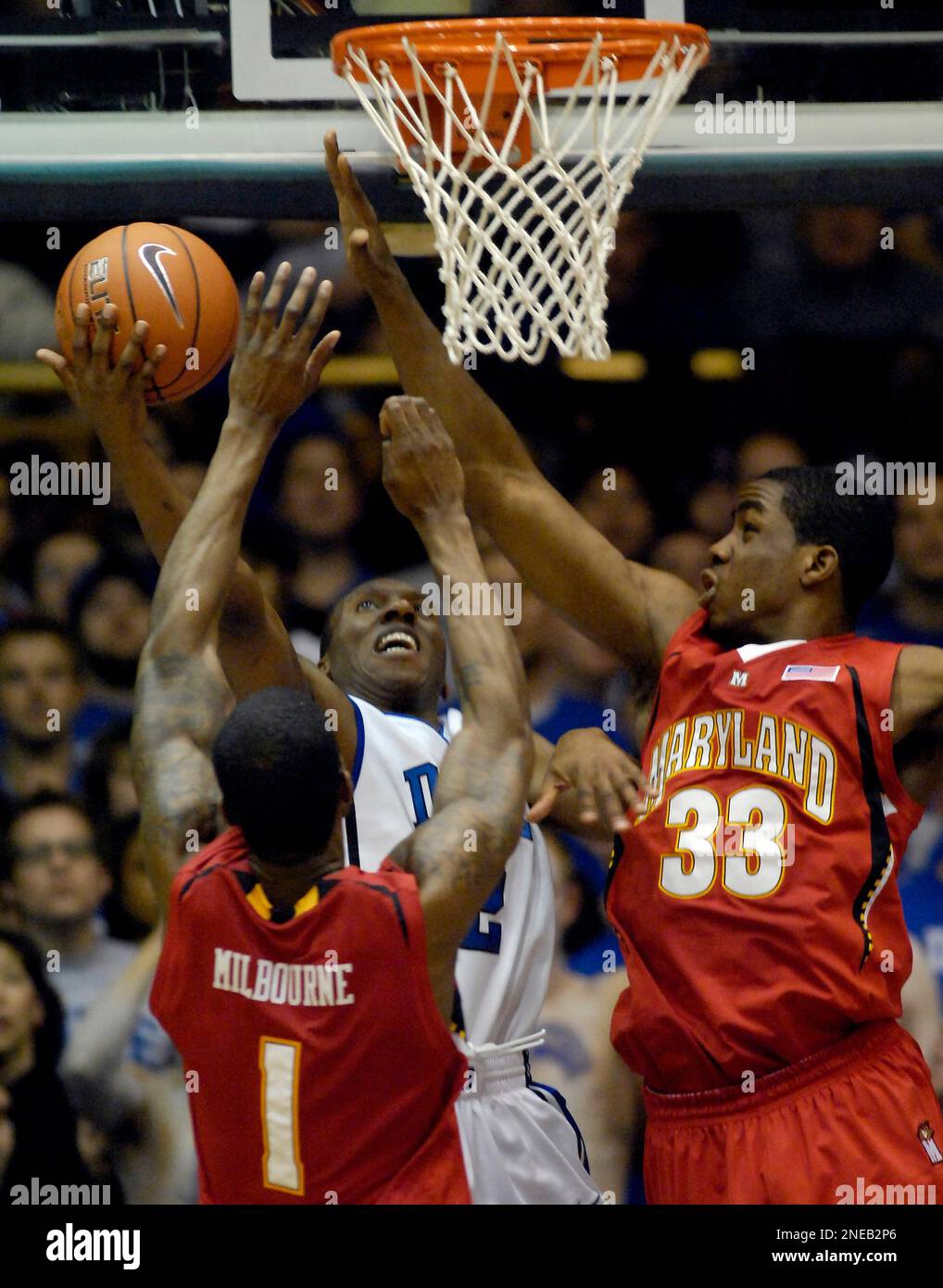 Maryland's Dino Gregory (33) and Landon Milbourne (1) block Duke's ...