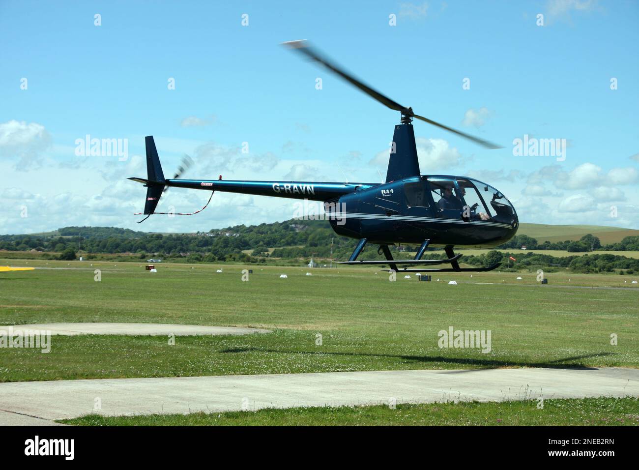 A Robinson R44 Raven helicopter landing at Brighton City Airport Stock ...