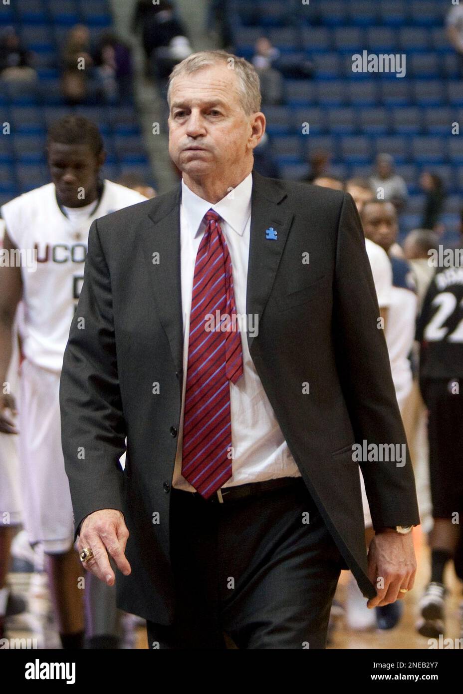 Connecticut head coach Jim Calhoun, walks off the court after their 60 ...