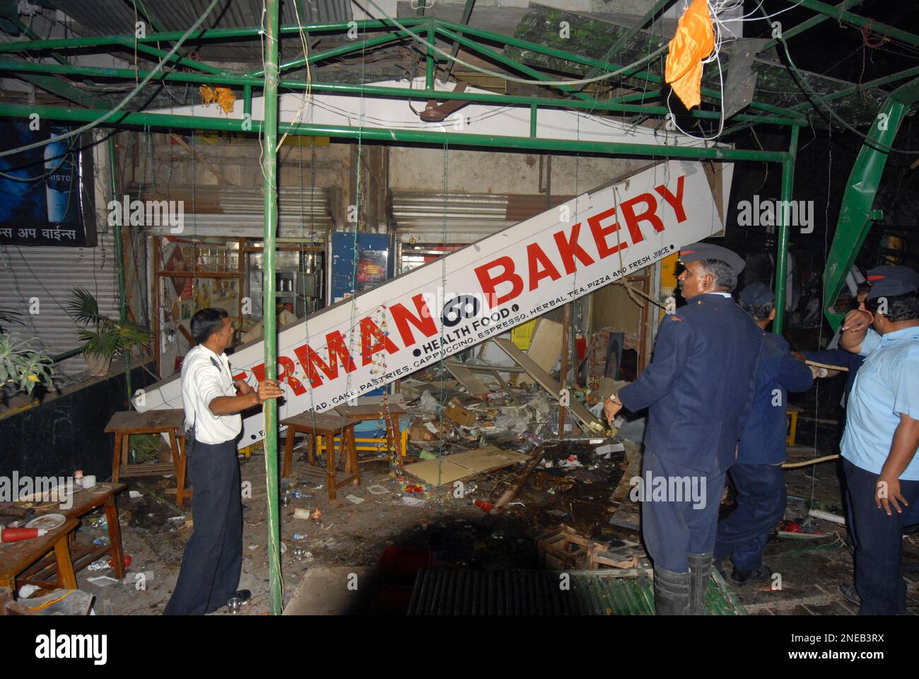 Indian police and rescue workers inspect the scene of an explosion in a ...