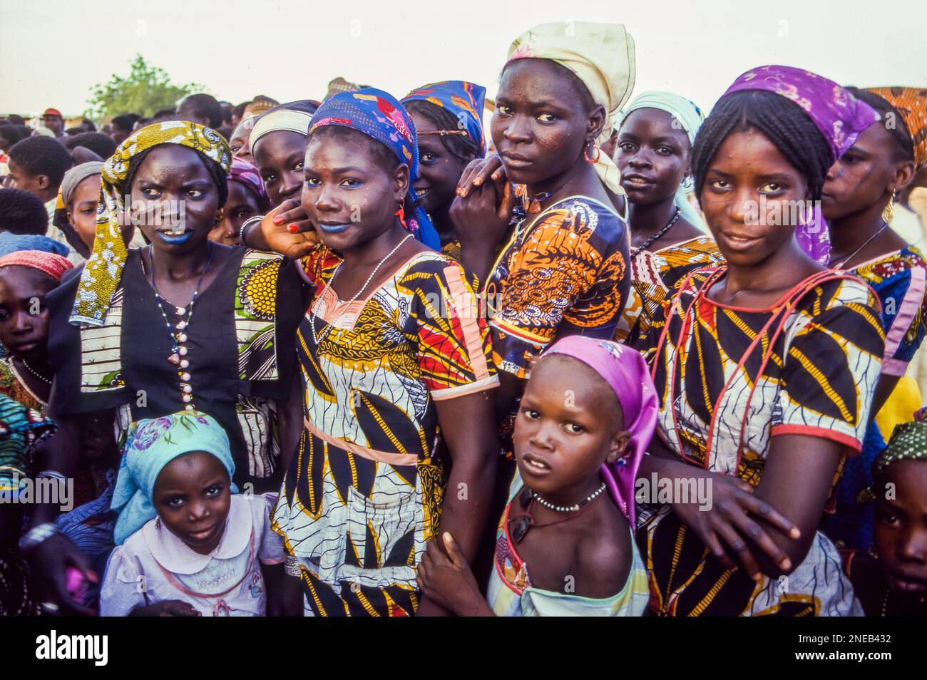 Niger, women of the Haussa tribe with children wearing traditional ...