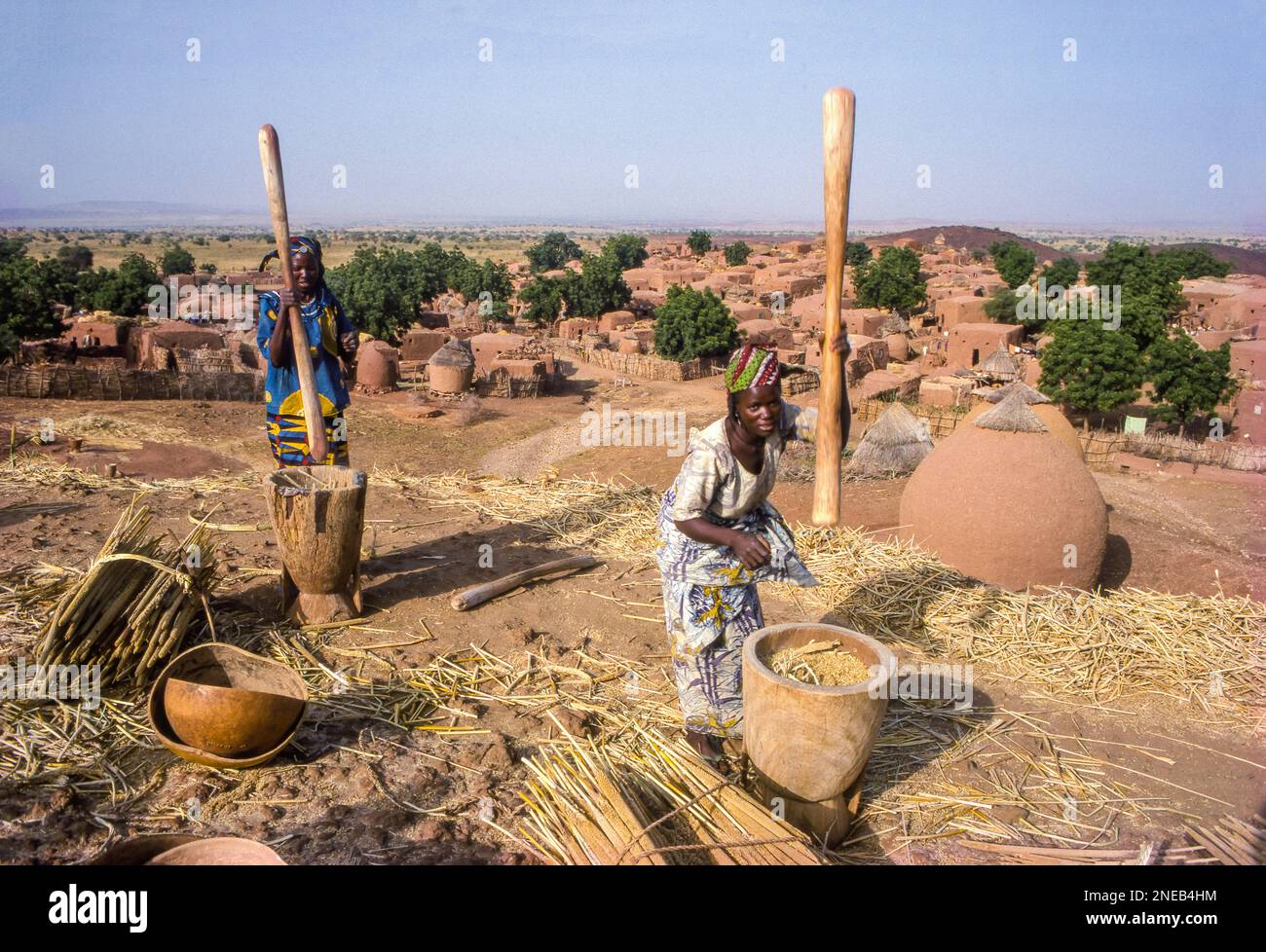 Niger, Tahoua - women from Haussa tribe pounding millet in front of ...