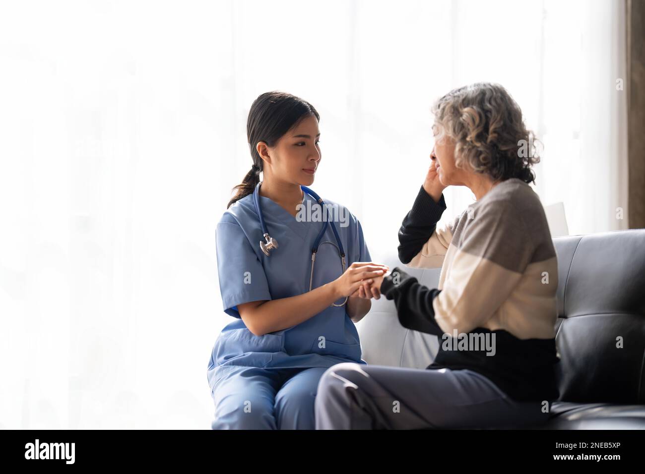 Young Caregiver Helping Senior Woman Walking Nurse Assisting Her Old