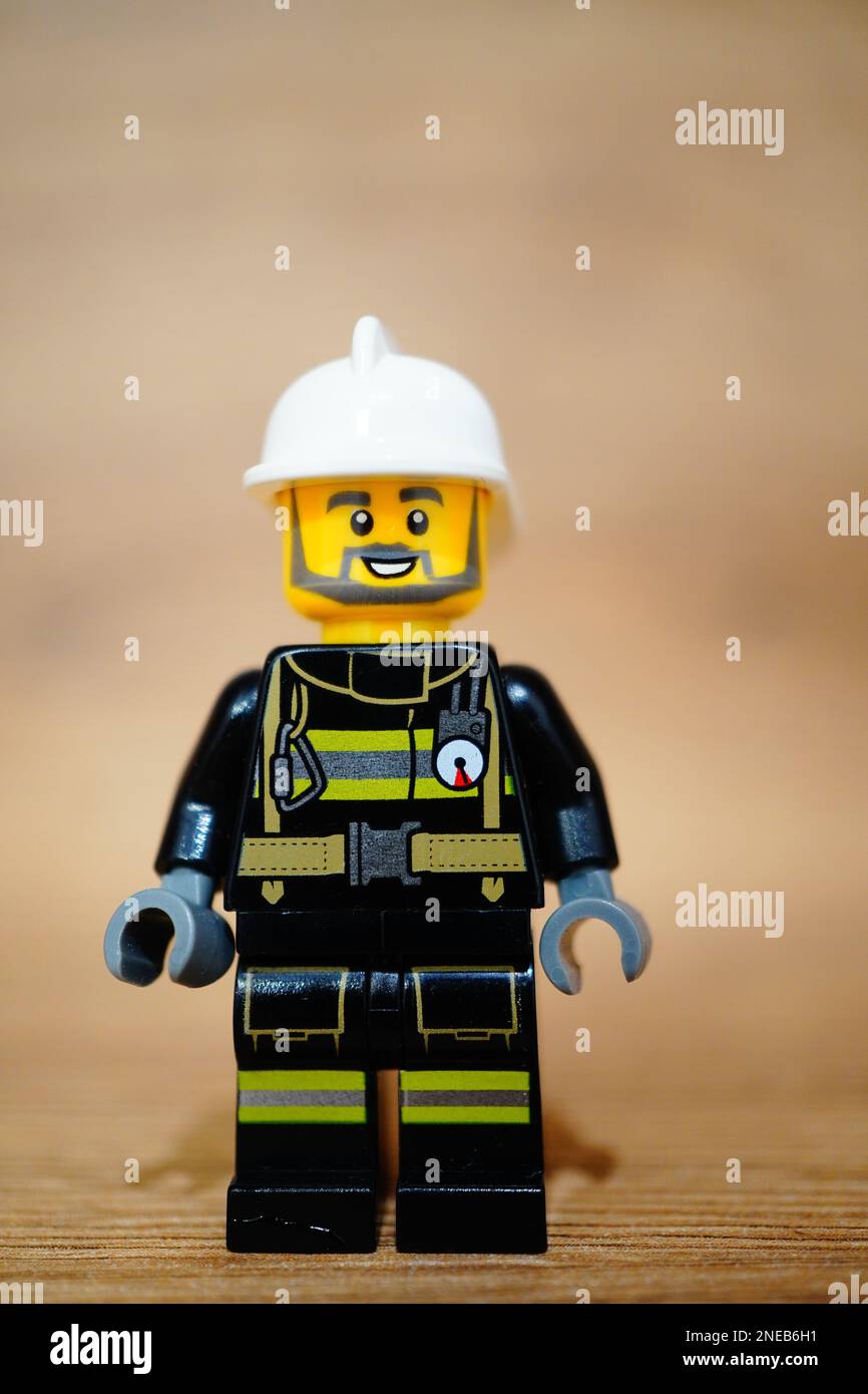 A Lego firefighter figurine with helmet and beard Stock Photo - Alamy