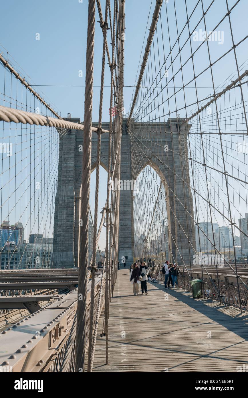 New York, USA - November 21, 2022: People walking on Brooklyn Bridge, a ...