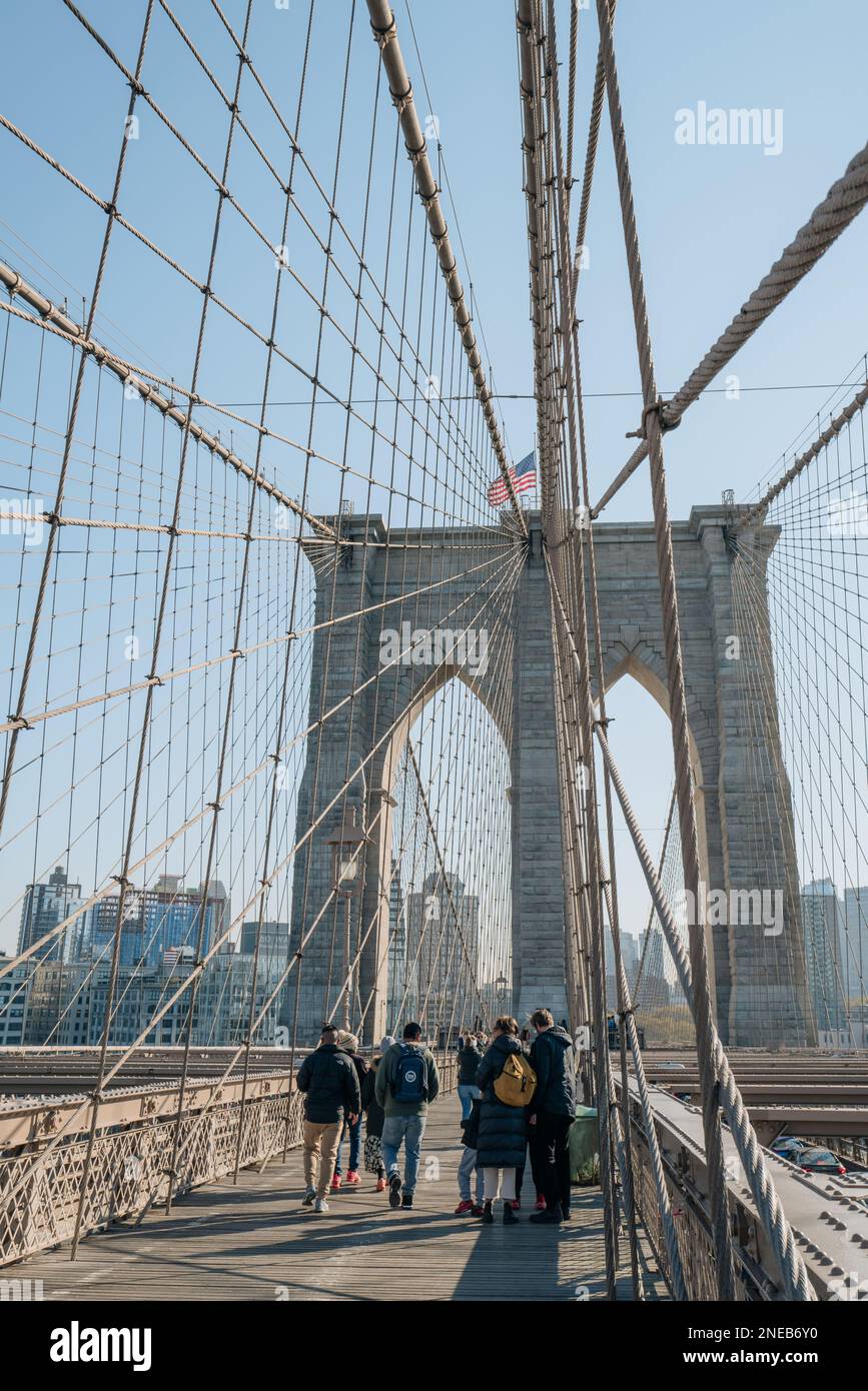 New York, USA - November 21, 2022: People walking on Brooklyn Bridge, a ...