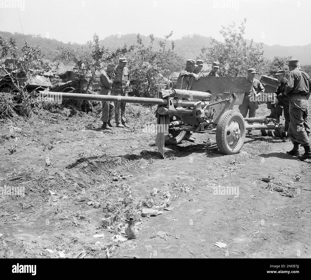 Officers and GI?s inspect a Russian made 57mm anti-tank gun on Korea?s ...