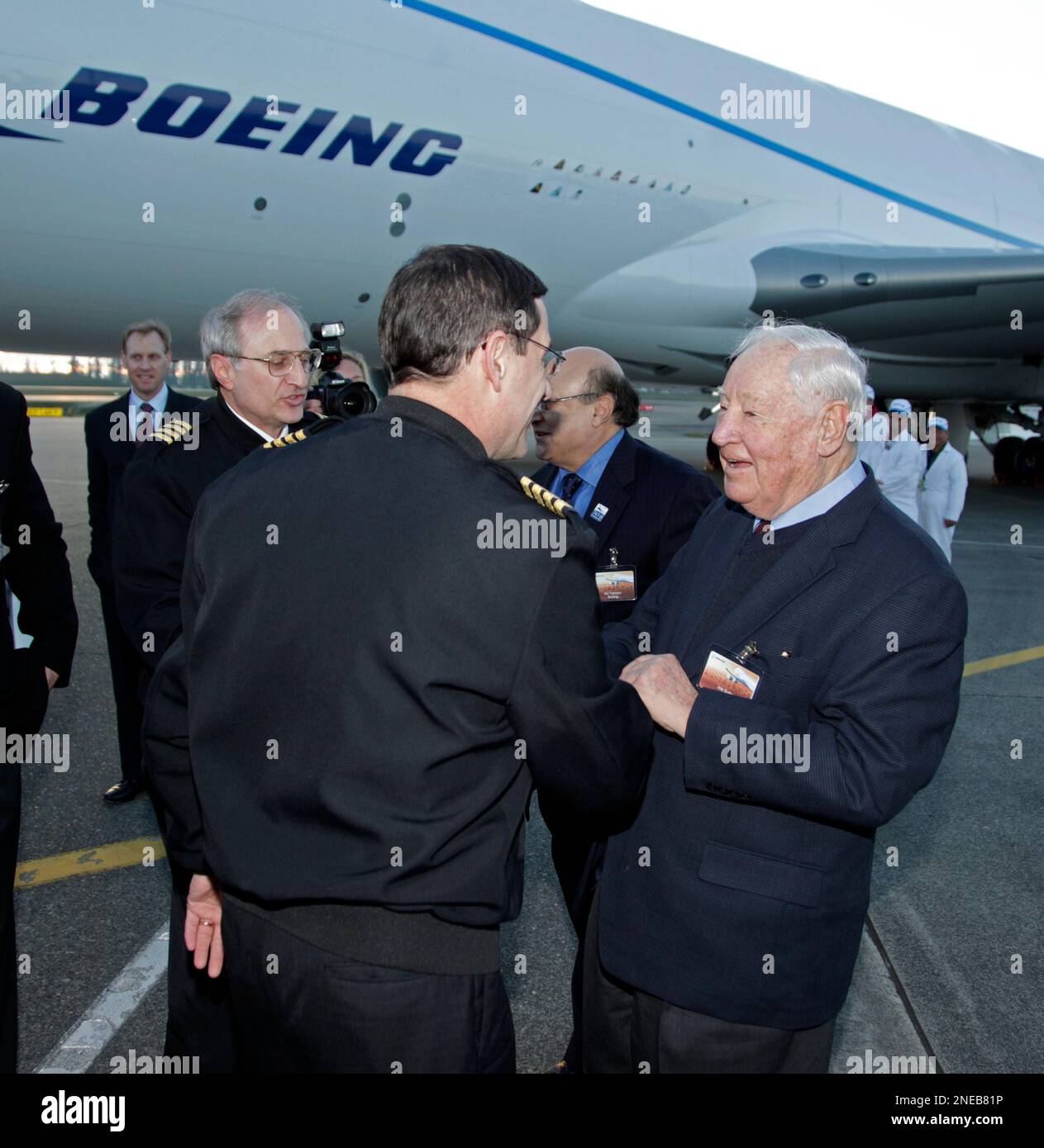 Capt. Mark Feuerstein, Boeing Co.'s chief 747 pilot, center, and first ...