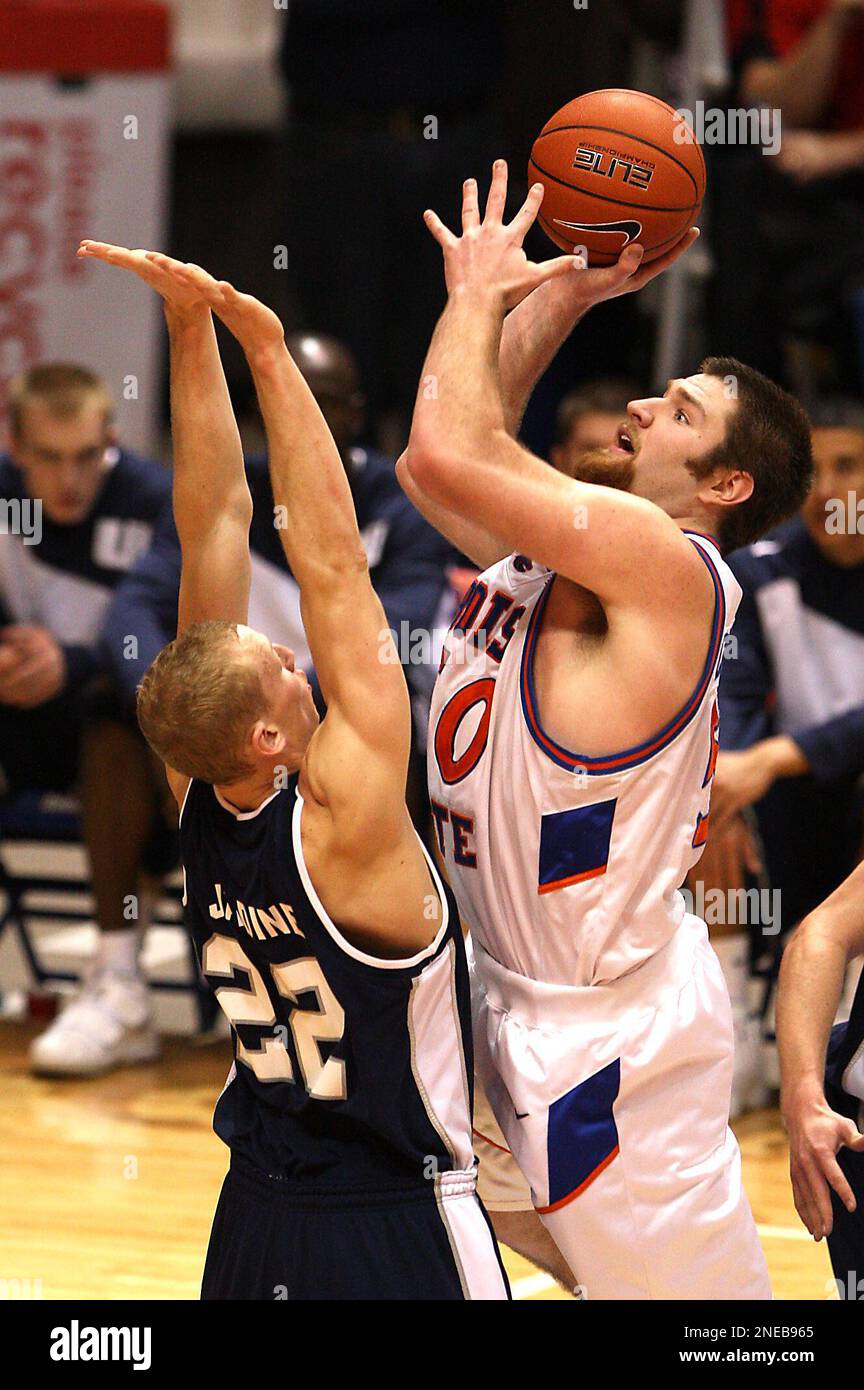 Boise State's Kurt Cunningham (50) shoots over Utah State's Brady Jardine (22) during the first ...