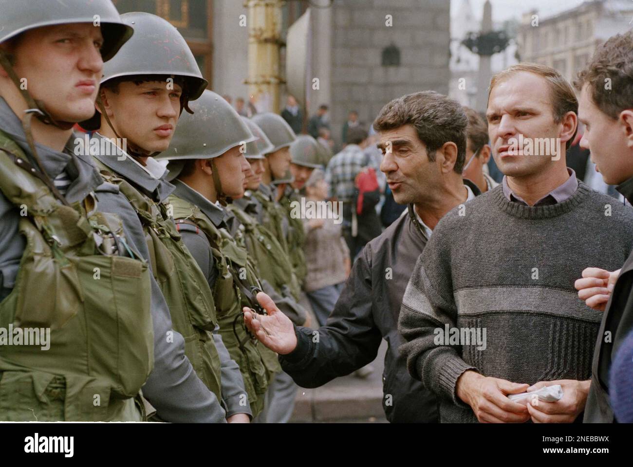 A Muscovite tries to debate with soldiers who guard the Manezh Square ...