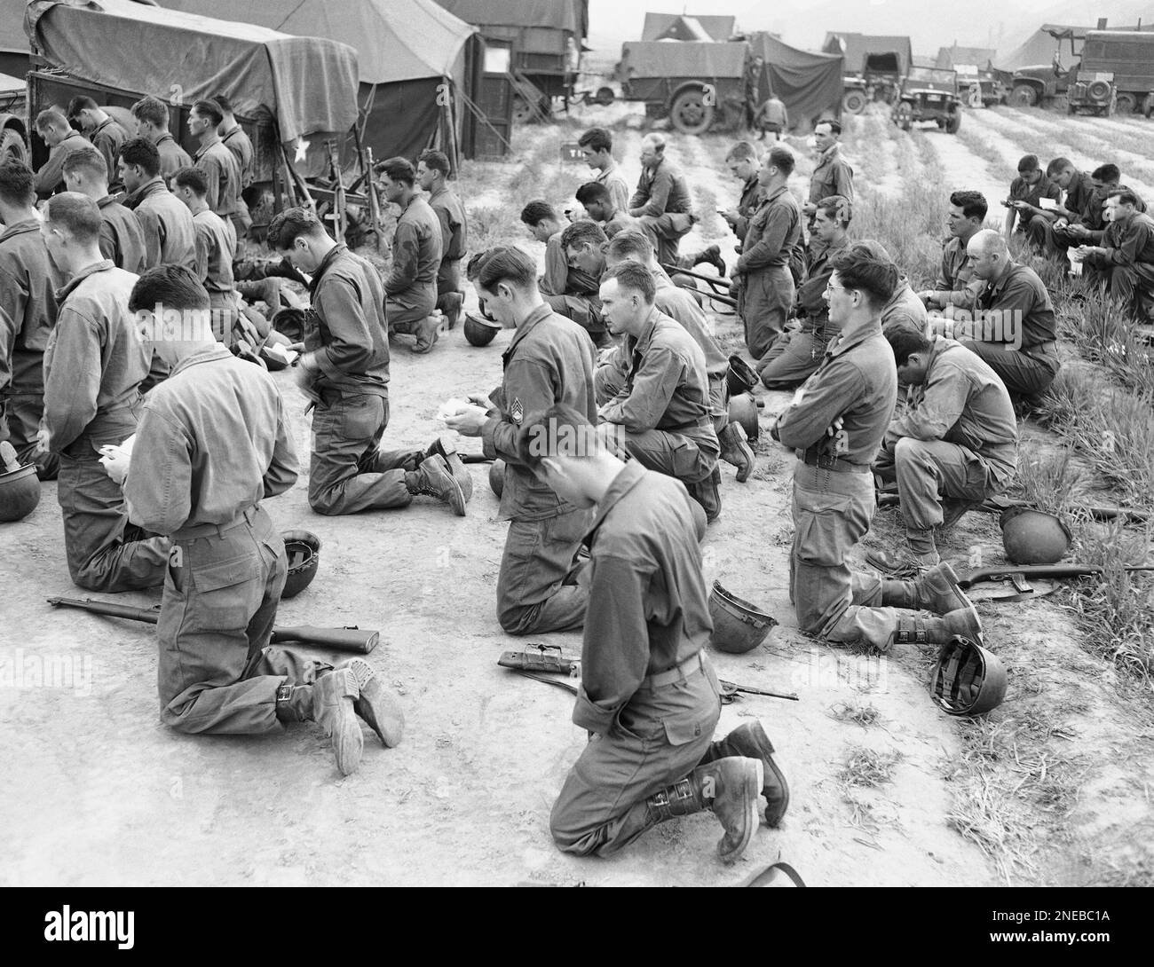 With weapons and helmets close at hand, U.S. 24th Division soldiers ...