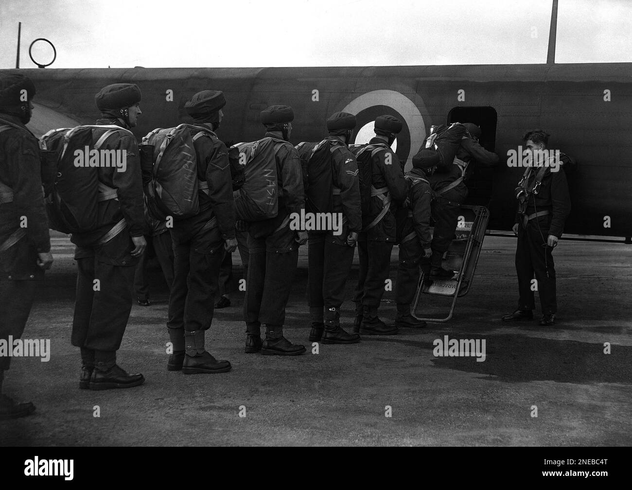 Paratroopers are preparing to enter their troop carrying planes, during ...