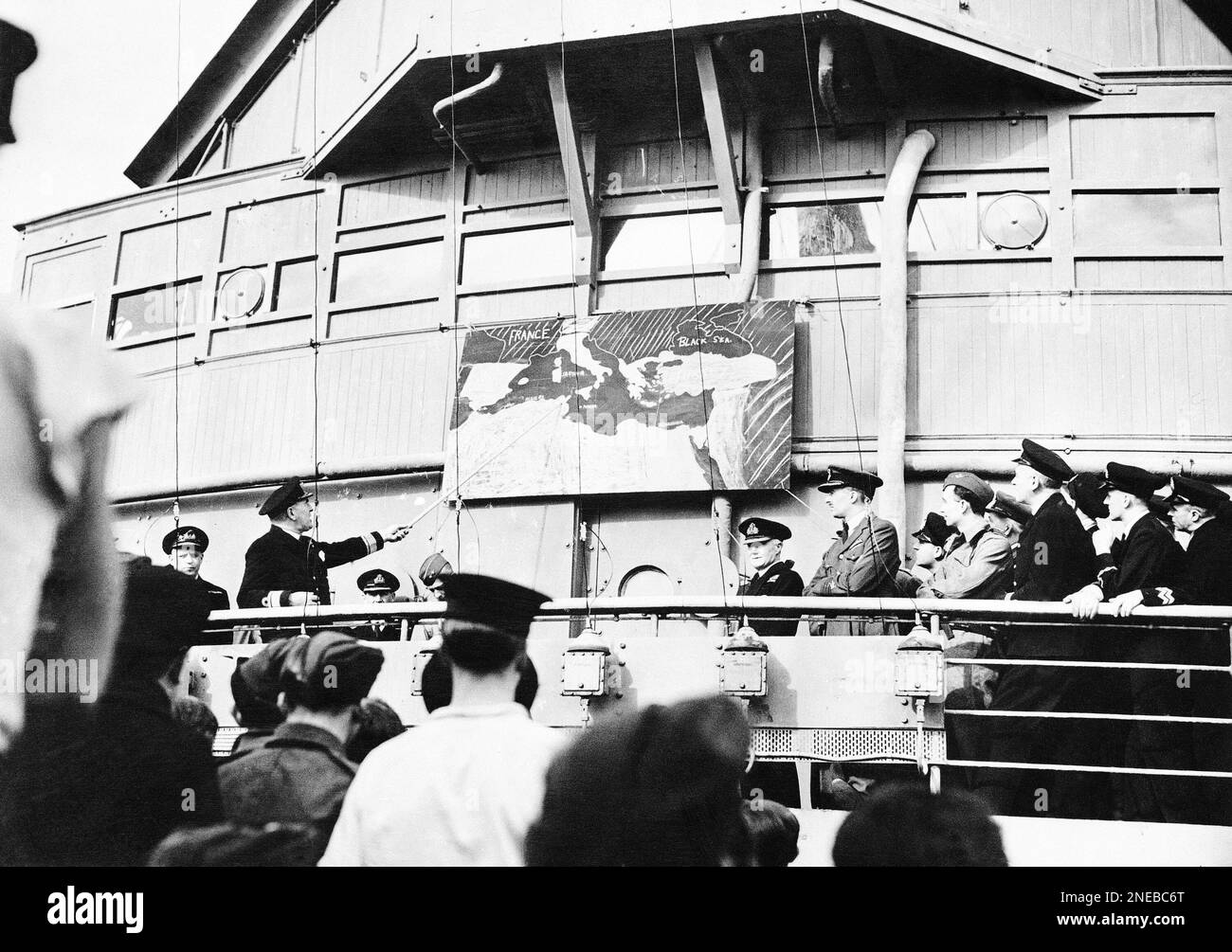 Rear Admiral Sir Harold Burrough uses a pointer to make clear his final ...