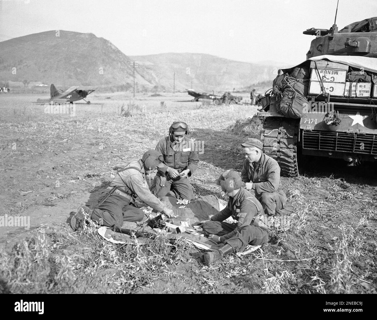U.S. 7th Division tank crew members, whose job is to guard the airstrip ...