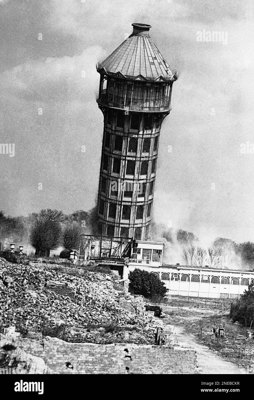 The north tower of the Crystal Palace topples under a dynamite charge ...