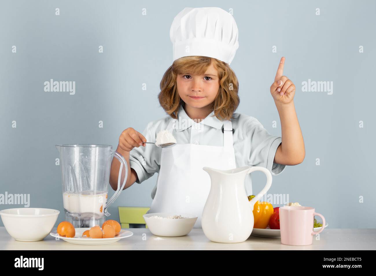 Cooking children. Chef kid boy making food with flour. Portrait of ...