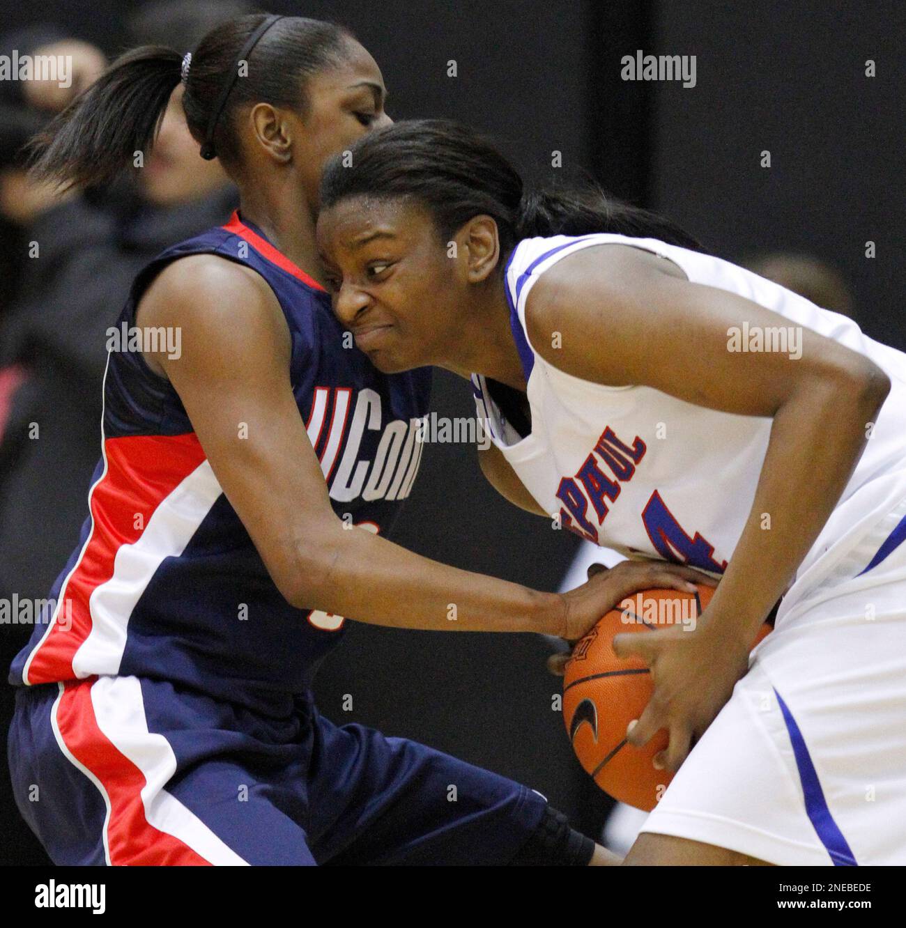 Connecticut's Tiffany Hayes, left, tries to steal the ball from DePaul ...
