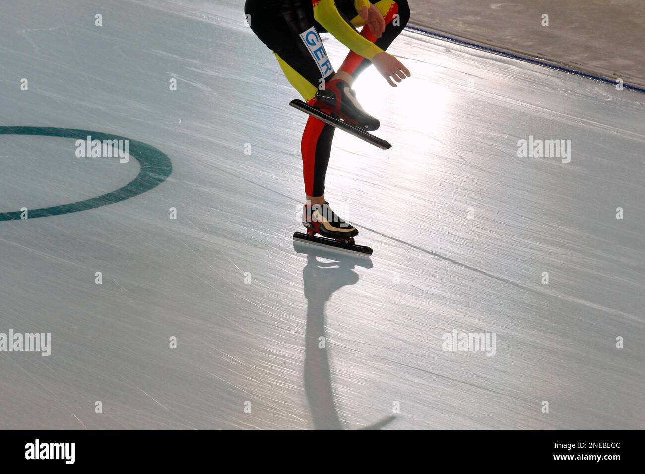 A member of the German speed skating team cleans the skates during a ...