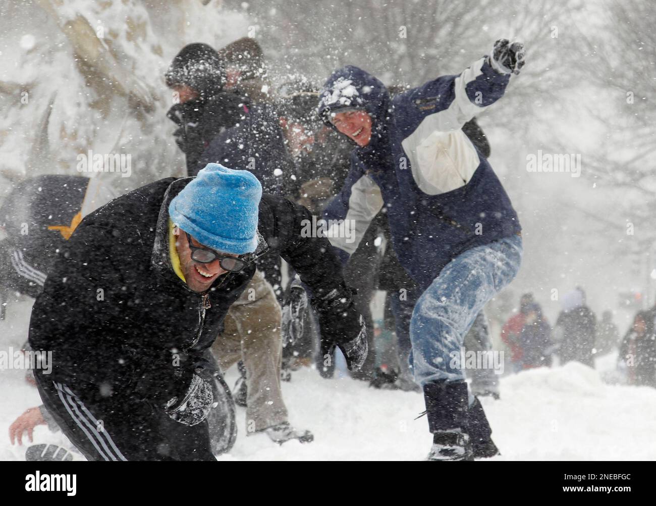 People enjoy a friendly snowball fight in DuPont Circle as the snow ...